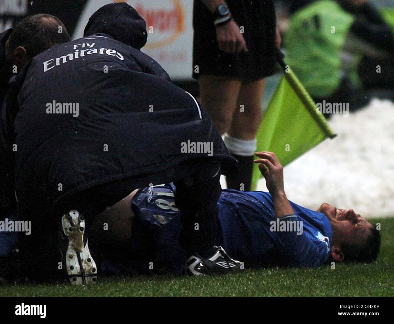 Chelsea's Wayne Bridge is stretchered off with a suspected broken ankle ...