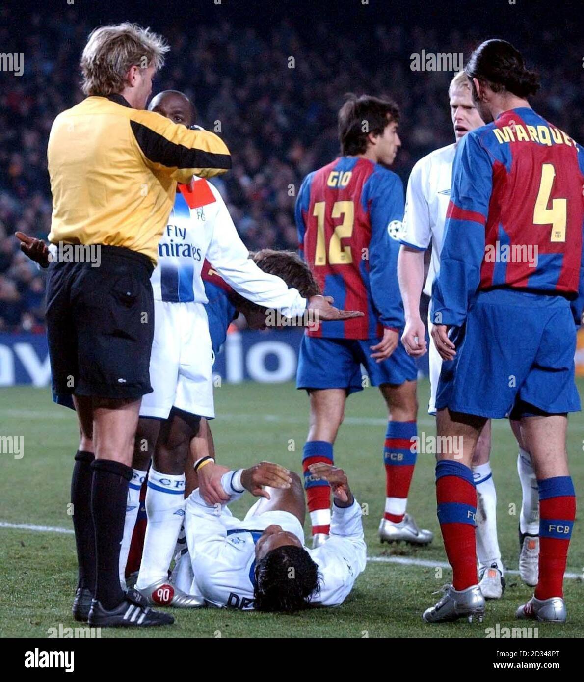 Chelsea's Didier Drogba (bottom) is sent off by referee Anders Frisk ...
