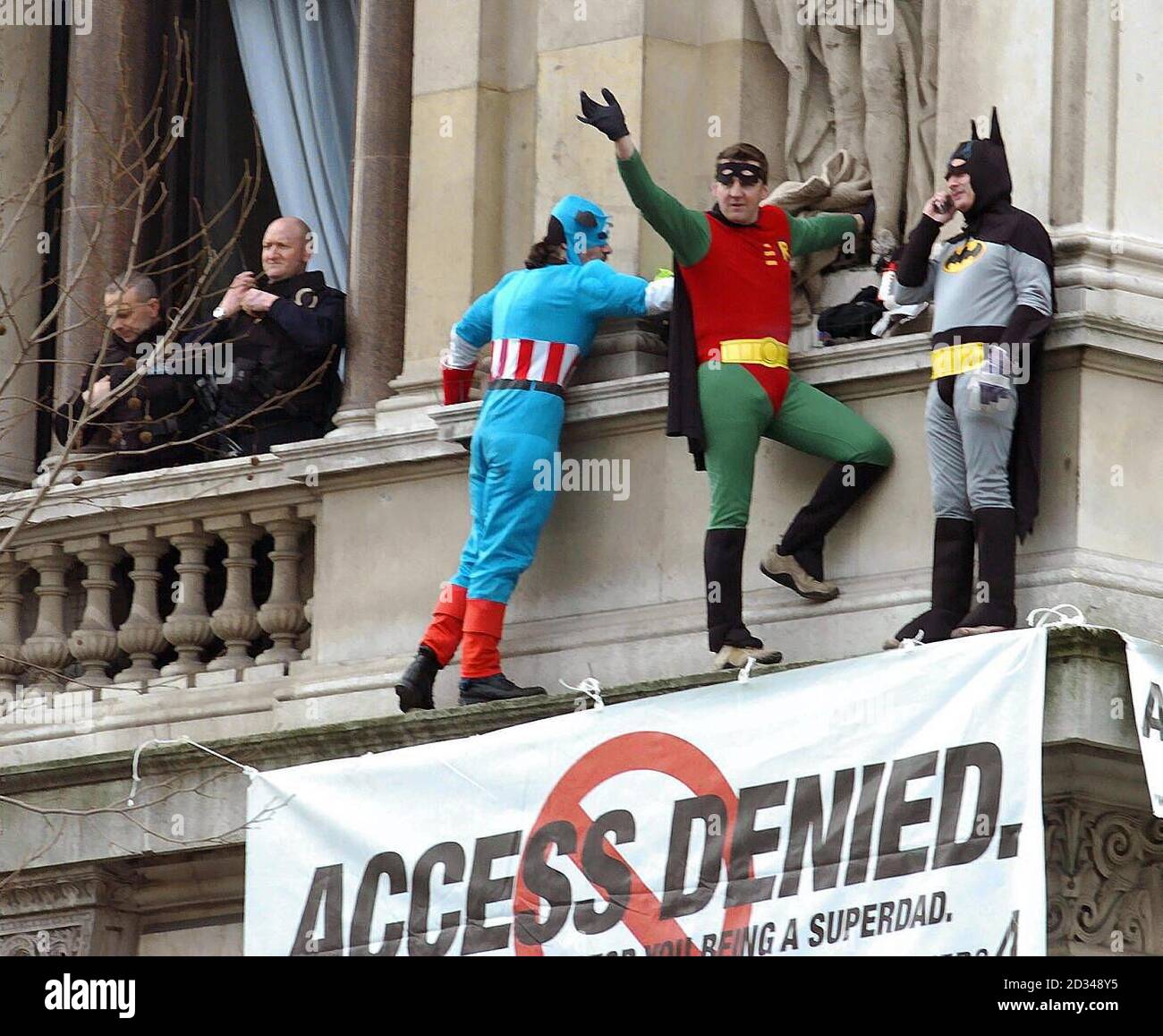 Three members of the Fathers 4 Justice dressed as superheroes Captain ...