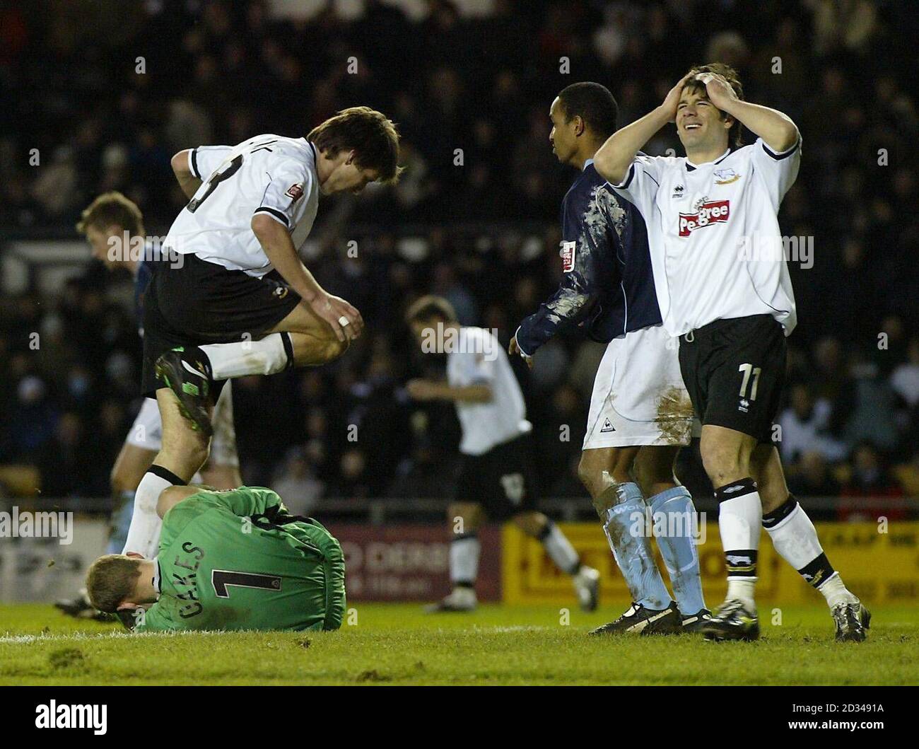 Wolverhampton Wanderers keeper Michael Oakes saves at the feet of Derby ...