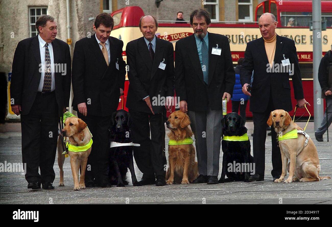 (L-R) Robert Blackwood & guide dog Cirk, Tom Ray & guide dog Raffles ...