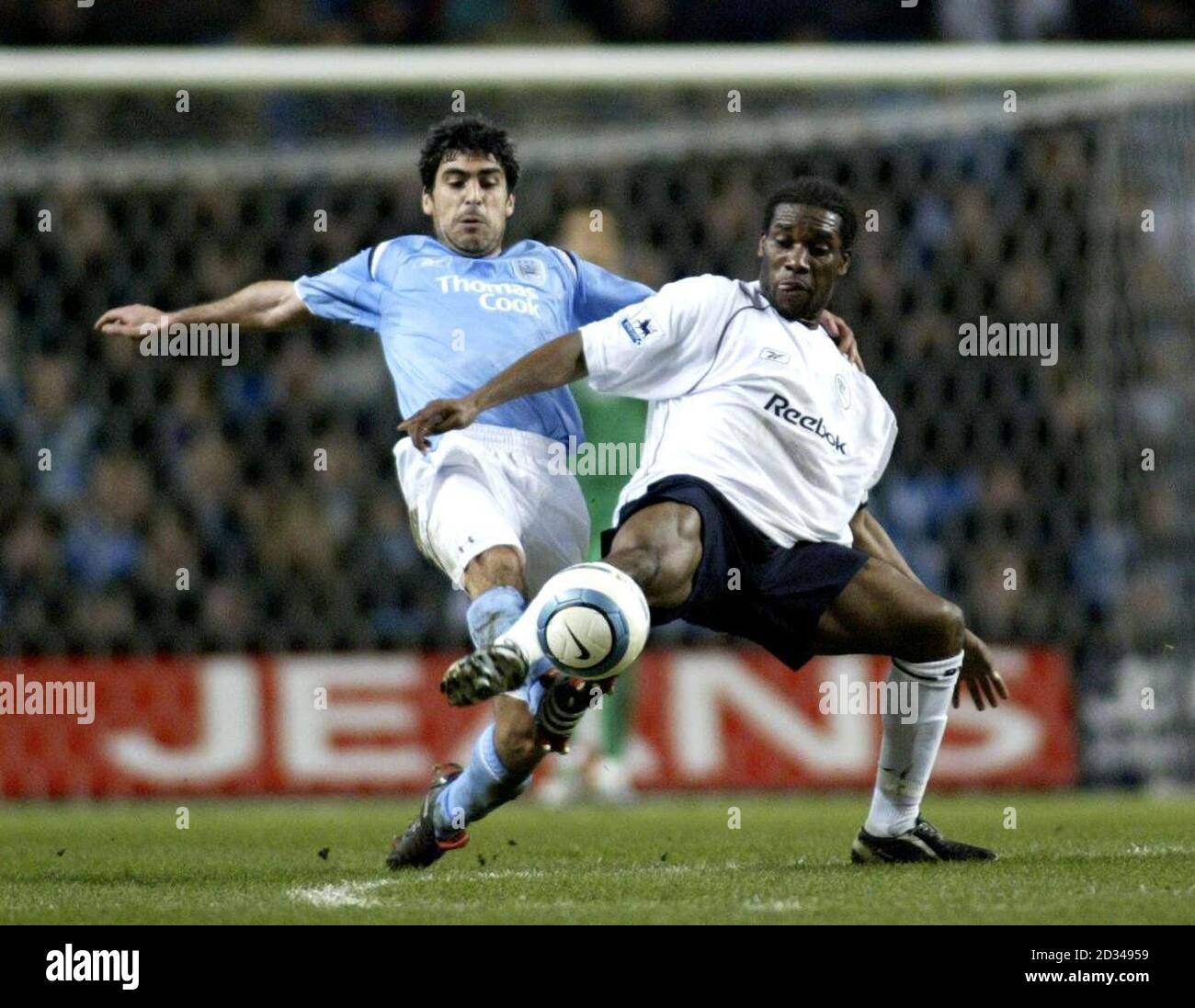 Bolton Wanderers' Jay-Jay Okocha (right) tussles with Manchester City's ...