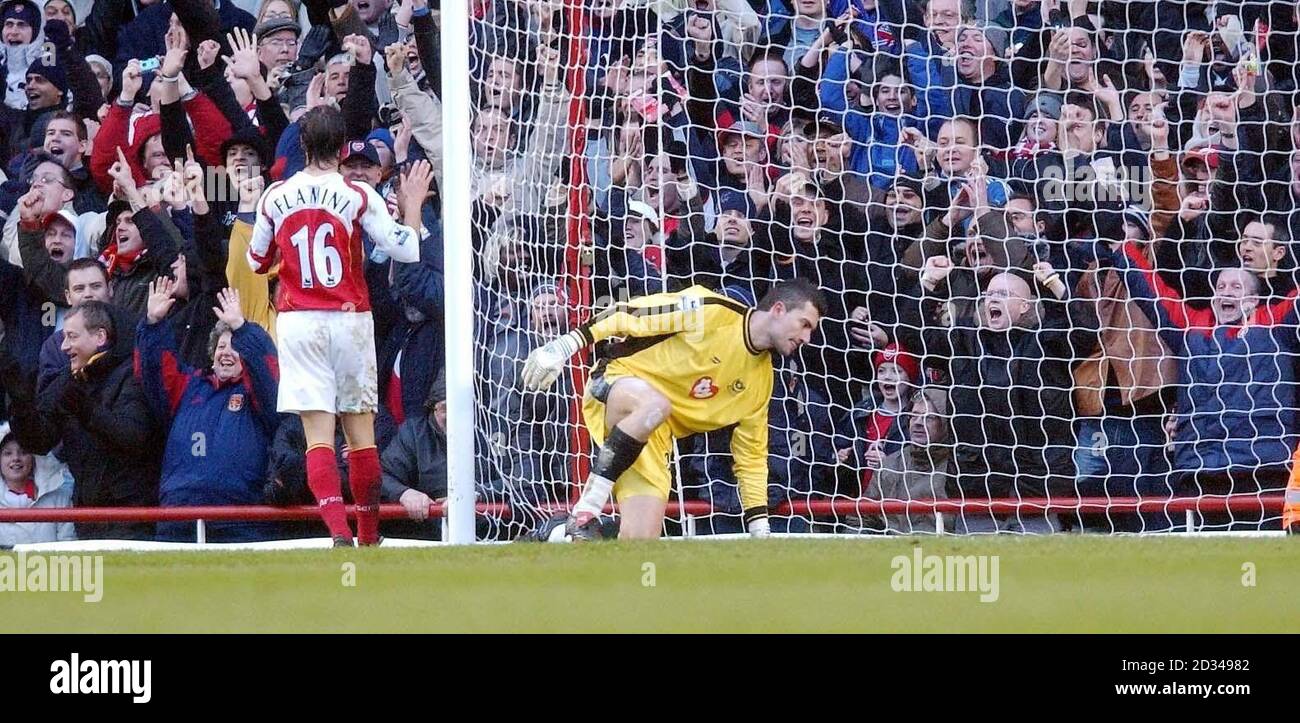 Portsmouth goalkeeper Konstantinos Chalkias on the ground after Thierry ...