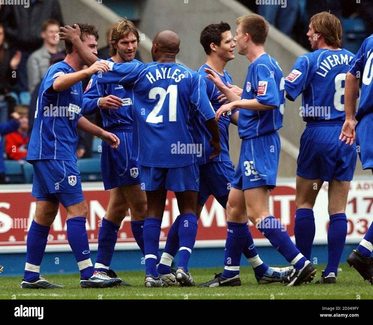 Millwall's Peter Sweeney (left) celebrates his goal against Plymouth ...