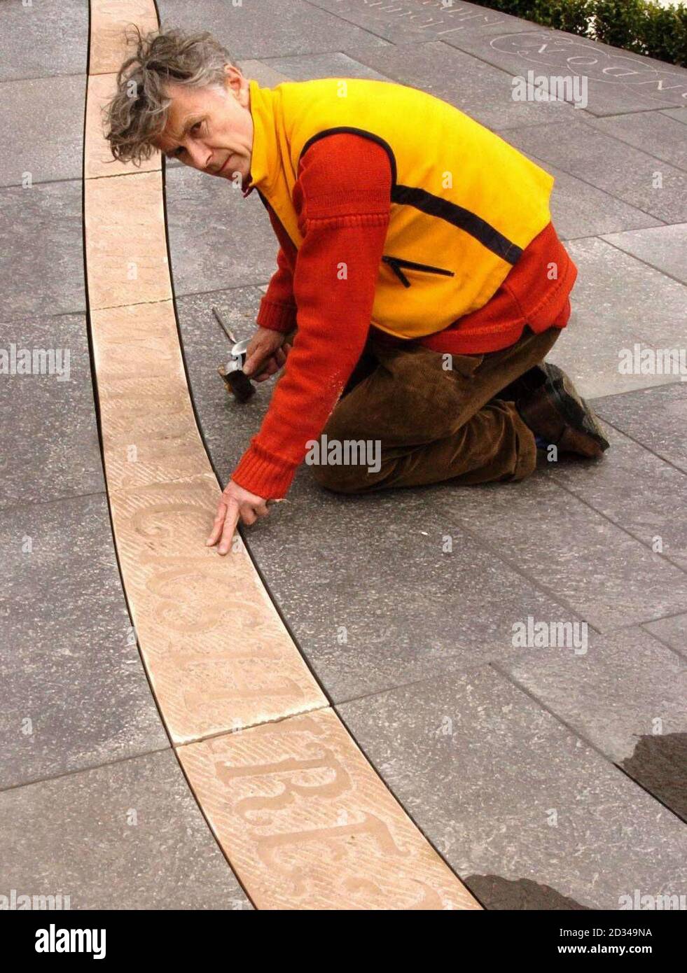 British artist and sculptor Simon Verity demonstrating his stone ...