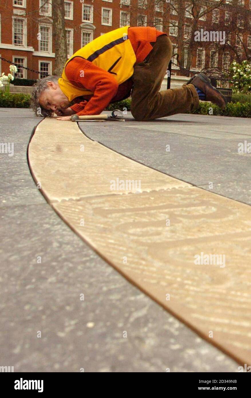 British artist and sculptor Simon Verity demonstrating his stone ...