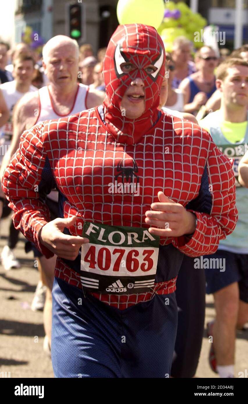 Fun runners cross Tower Bridge Stock Photo - Alamy