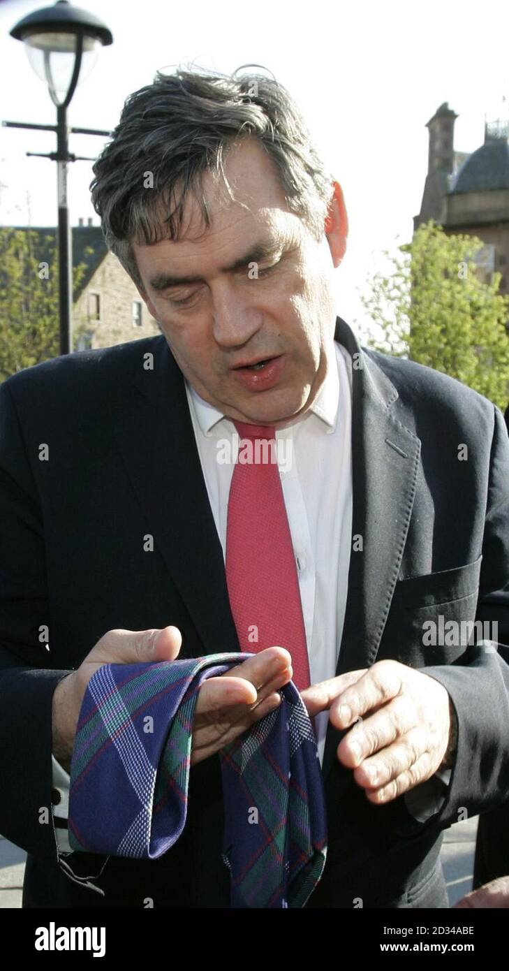 Chancellor Gordon Brown with a G8 summit tie given to him by designer ...