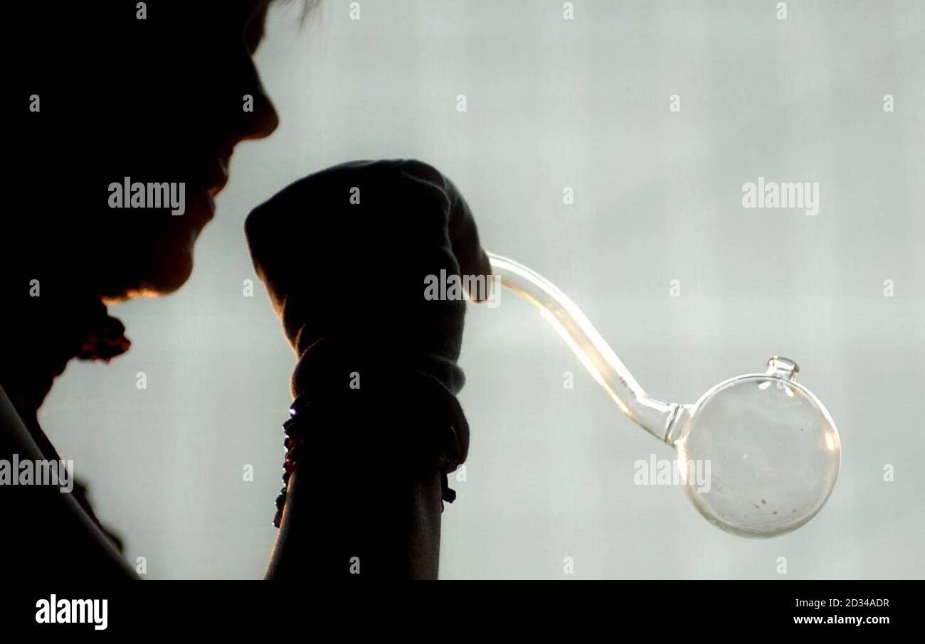 A Museum employee holds Hiram Maxim's 19th century Pipe of Peace. Maxim ...