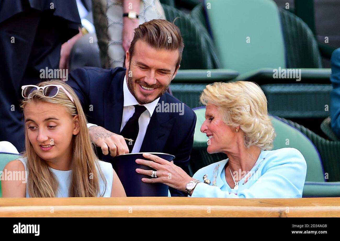 Gill Brook offers a sweet to David Beckham in the royal box during day ...