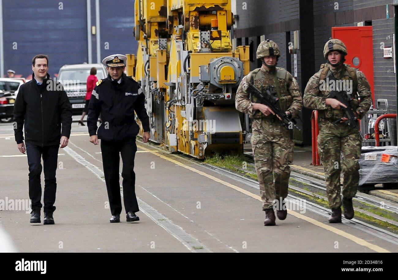 Chancellor of the Exchequer George Osborne (left) walks along the jetty ...