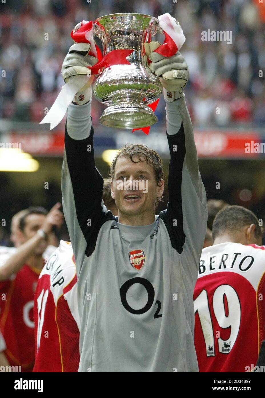 Arsenal goalkeeper Jens Lehmann lifts the FA Cup after defeating ...