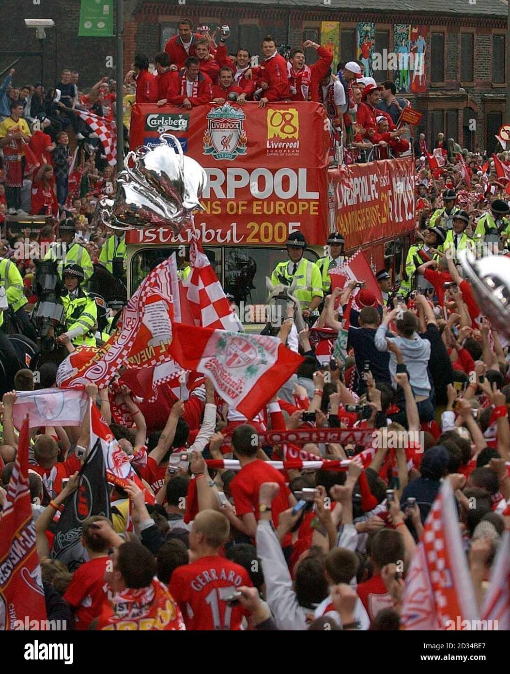 Liverpool players celebrate on an open-top bus during the victory ...