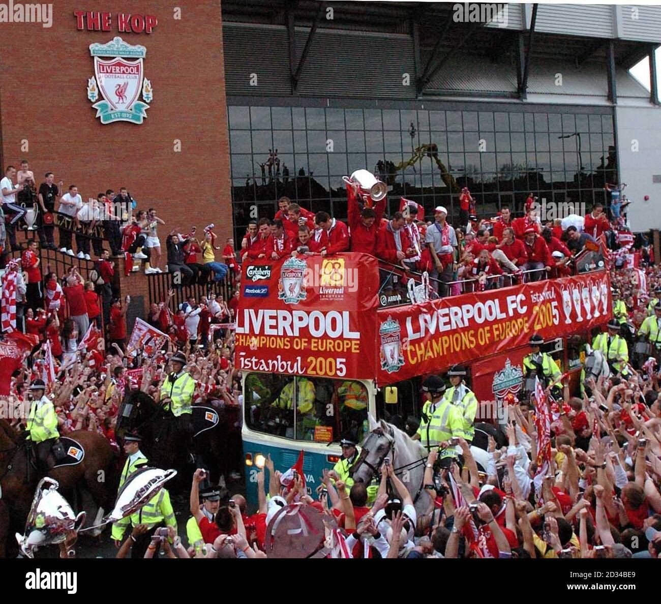 Liverpool players celebrate on an open-top bus during the victory ...