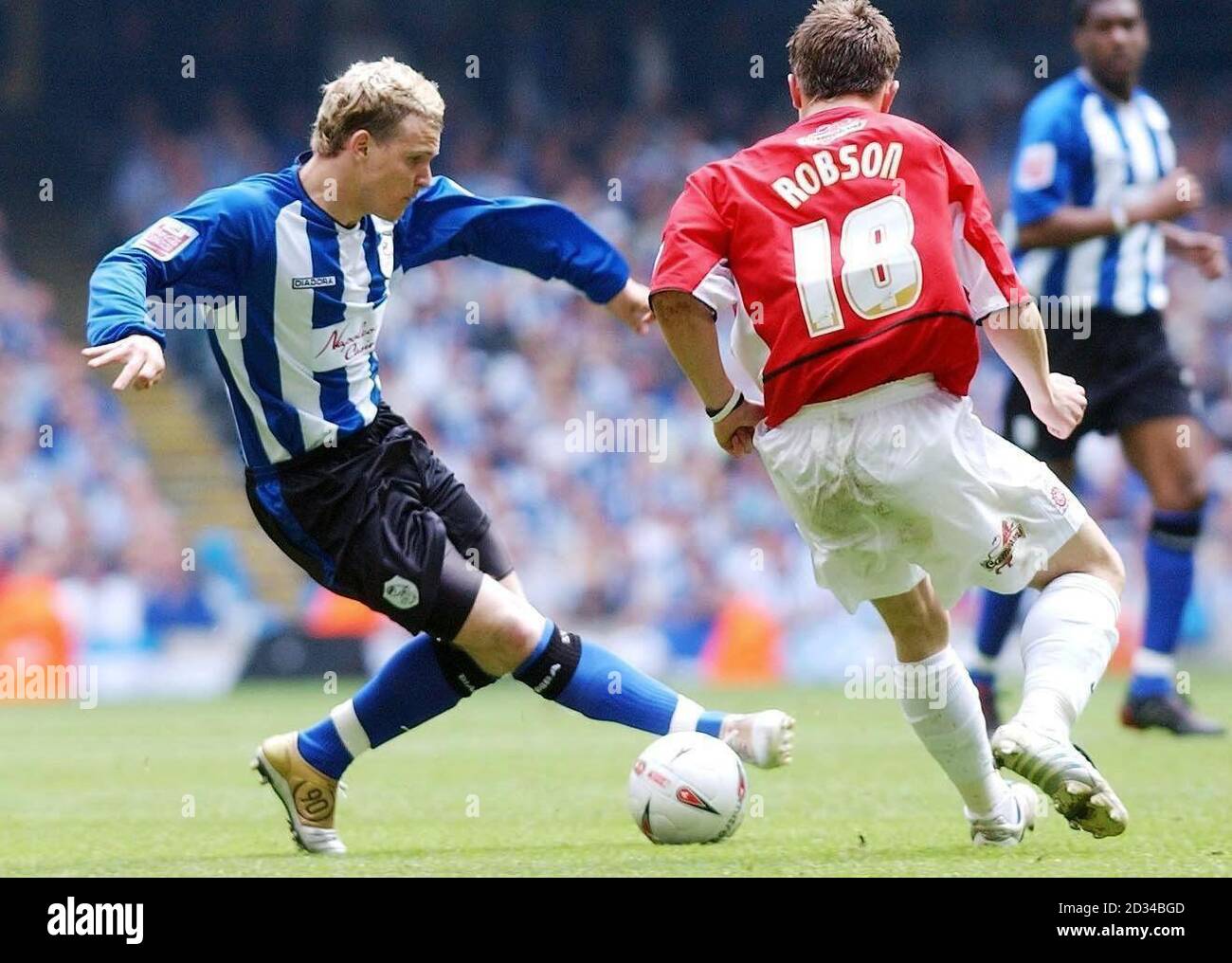 Sheffied Wednesday's Jon-Paul McGovern (L) battles with Hartlepool's ...