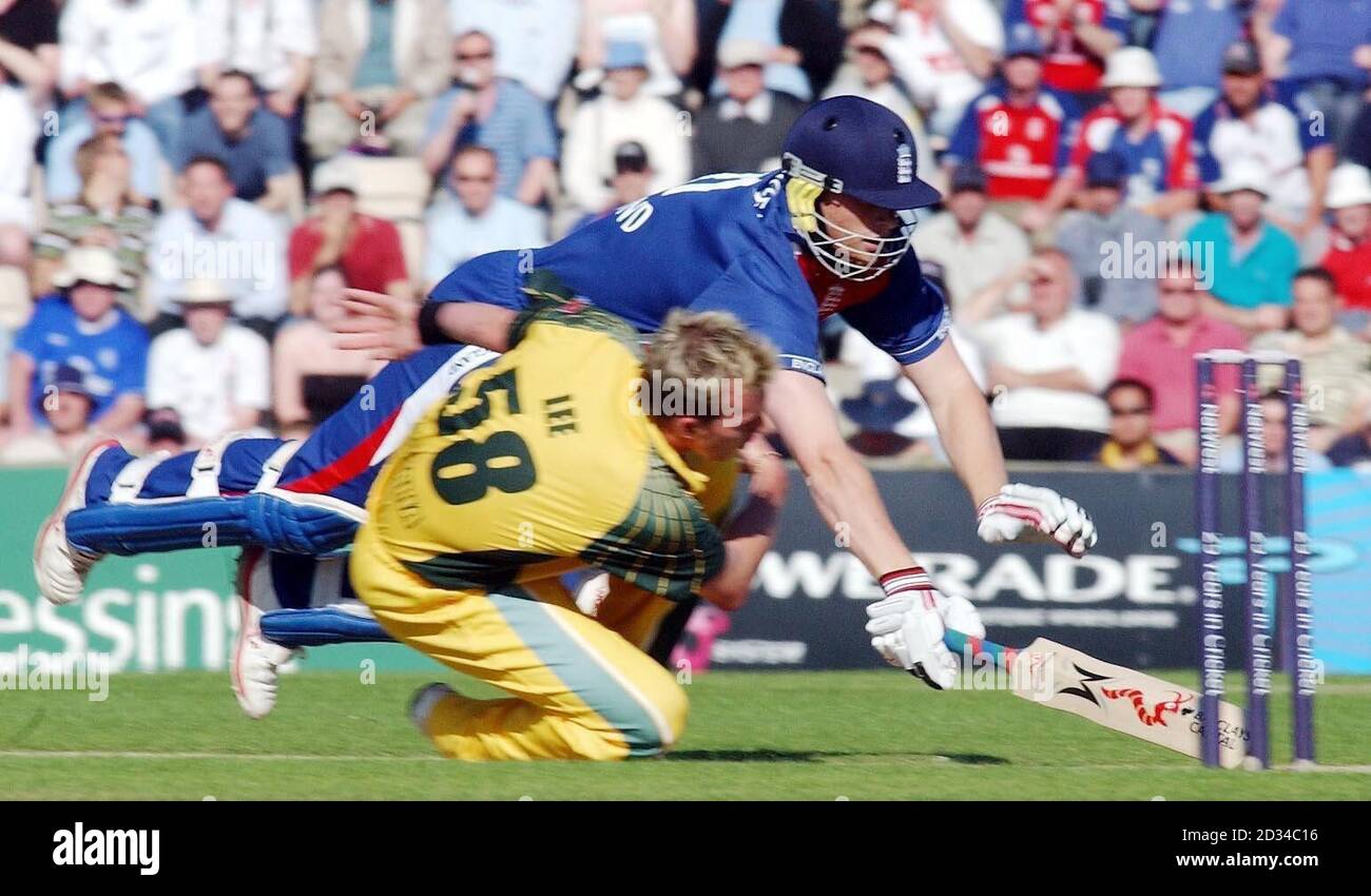 England's Andrew Flintoff (top) runs in safe as Australia's Brett Lee ...