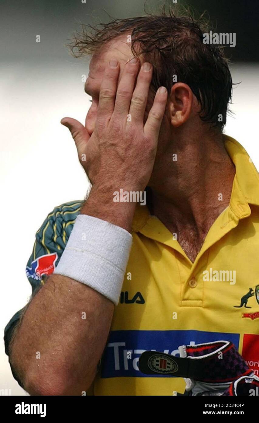 Australian batsman Matt Hayden appears dejected after being bowled out ...