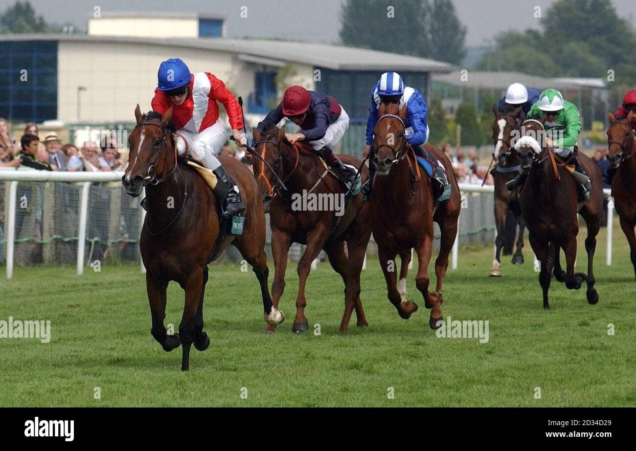 Echelon and jockey Ryan Moore (L) lead the field to go on and win the ...