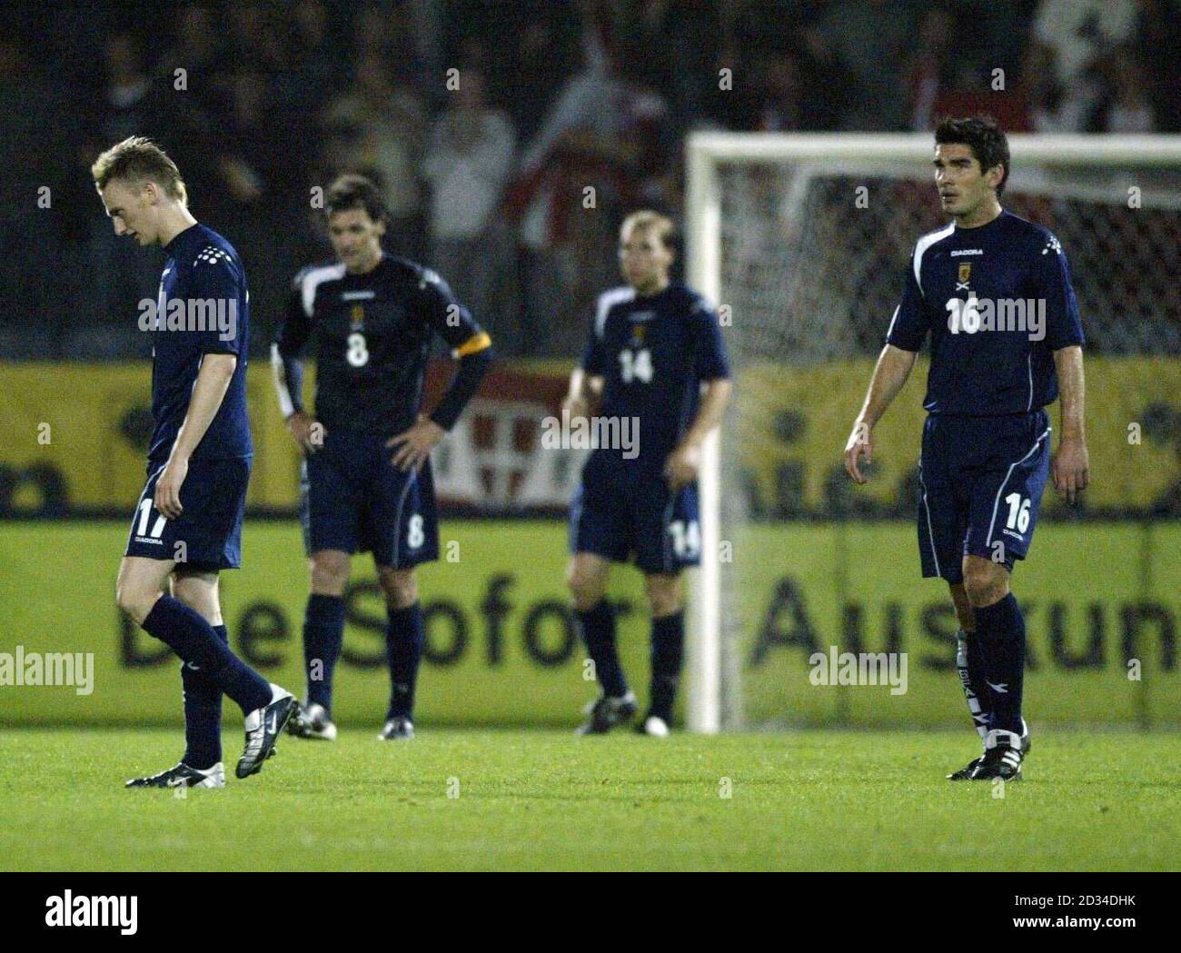 Scotland's Derek Riordan (L) and Richard Hughes (R) walk off dejected ...