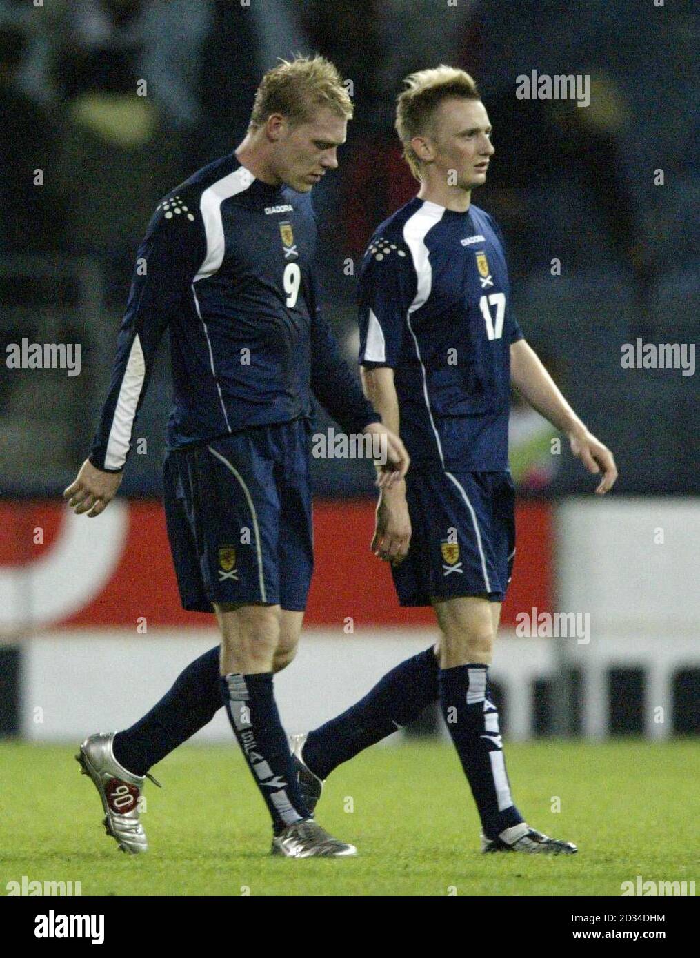 Scotland's 2nd goalscorer Garry O'Connor (L) walks off dejected with ...