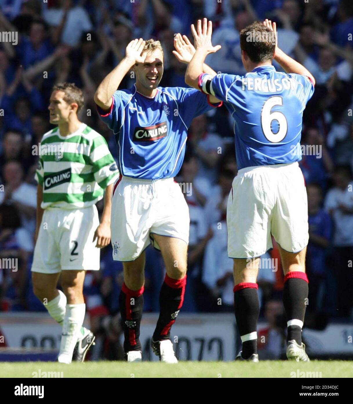 Rangers' Thomas Buffel celebrates with Barry Ferguson (R) after scoring ...