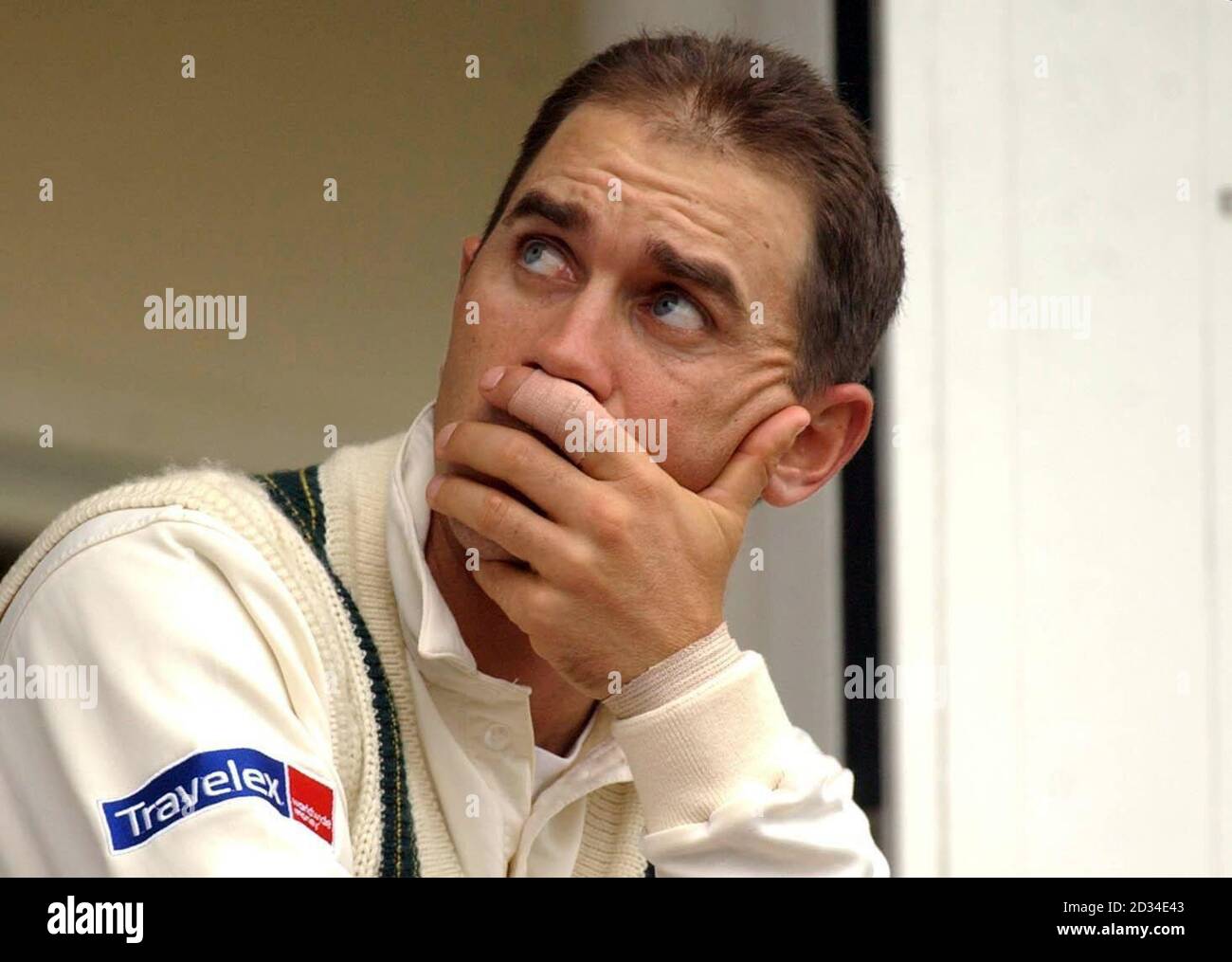 Australias justin langer looks up sky hi-res stock photography and ...