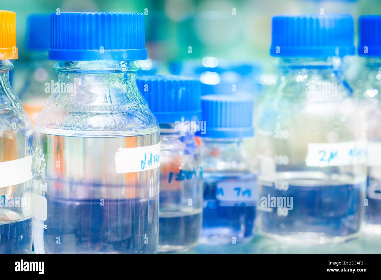 Rows of liquid chemicals in bottles at chemistry Stock Photo - Alamy Rows of liquid chemicals in bottles at chemistry Stock Photo - Alamy