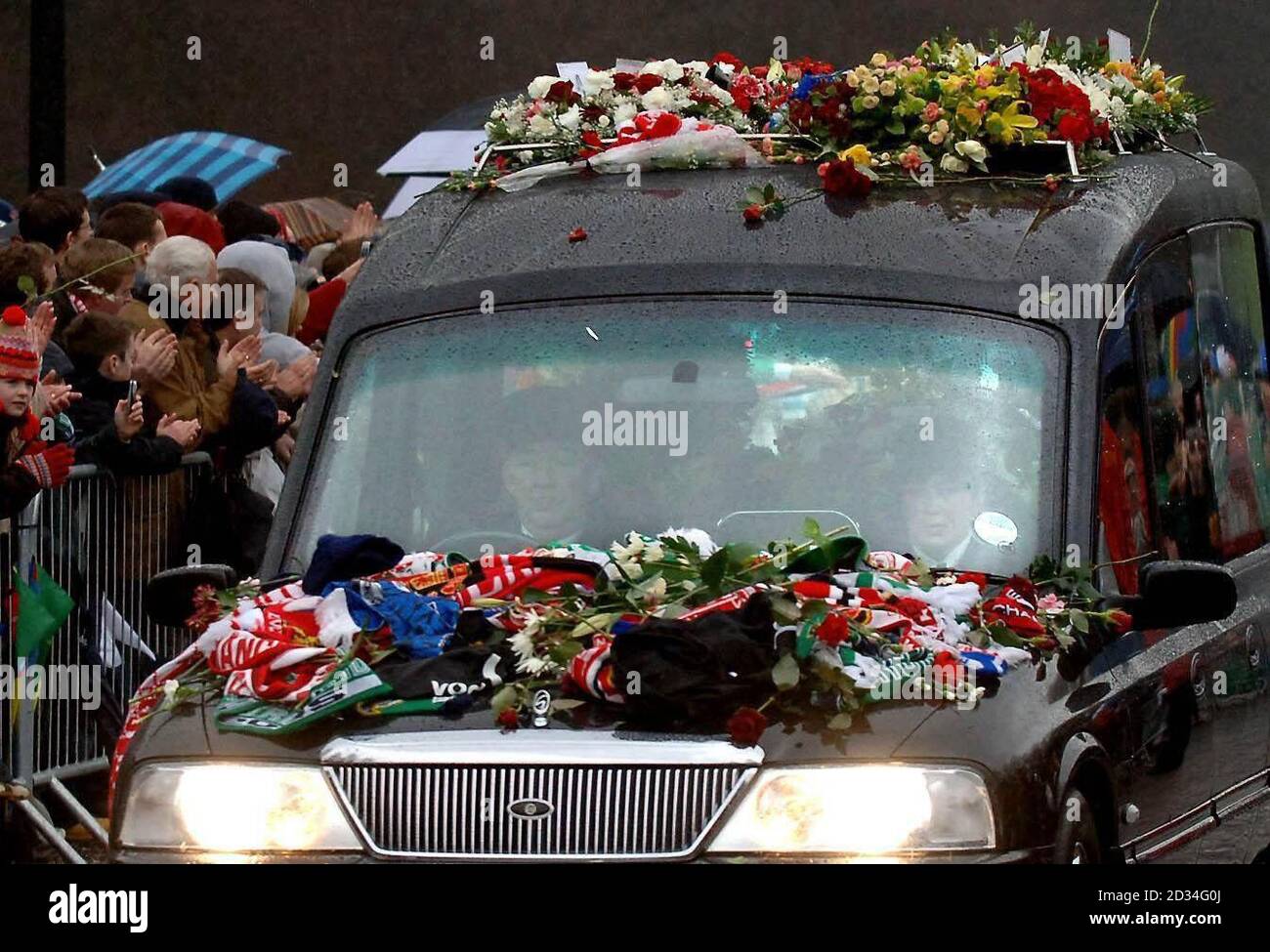 The funeral procession for george best leaves stormont hi-res stock ...
