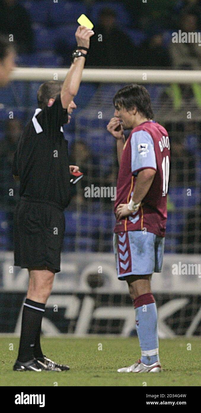 Aston Villa's Milan Baros is booked by referee Phil Dowd Stock Photo - Alamy