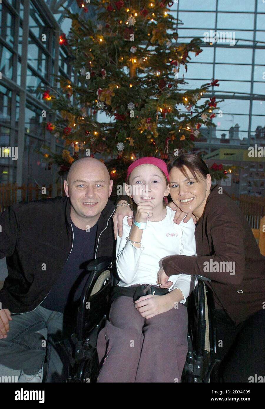 Amber Sisson (centre) with parents Justin and Amanda at St Thomas's ...