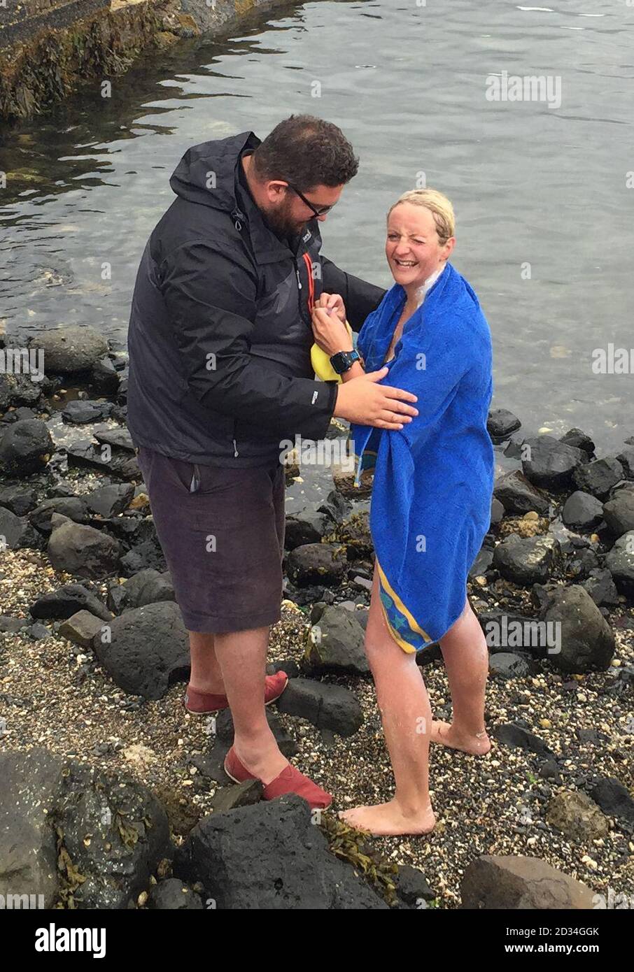 Heather Clatworthy is hugged by her husband Ian after landing at ...