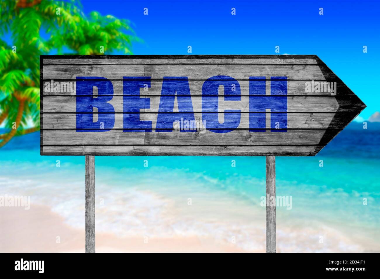 Beach wooden sign with a beach on background Stock Photo - Alamy