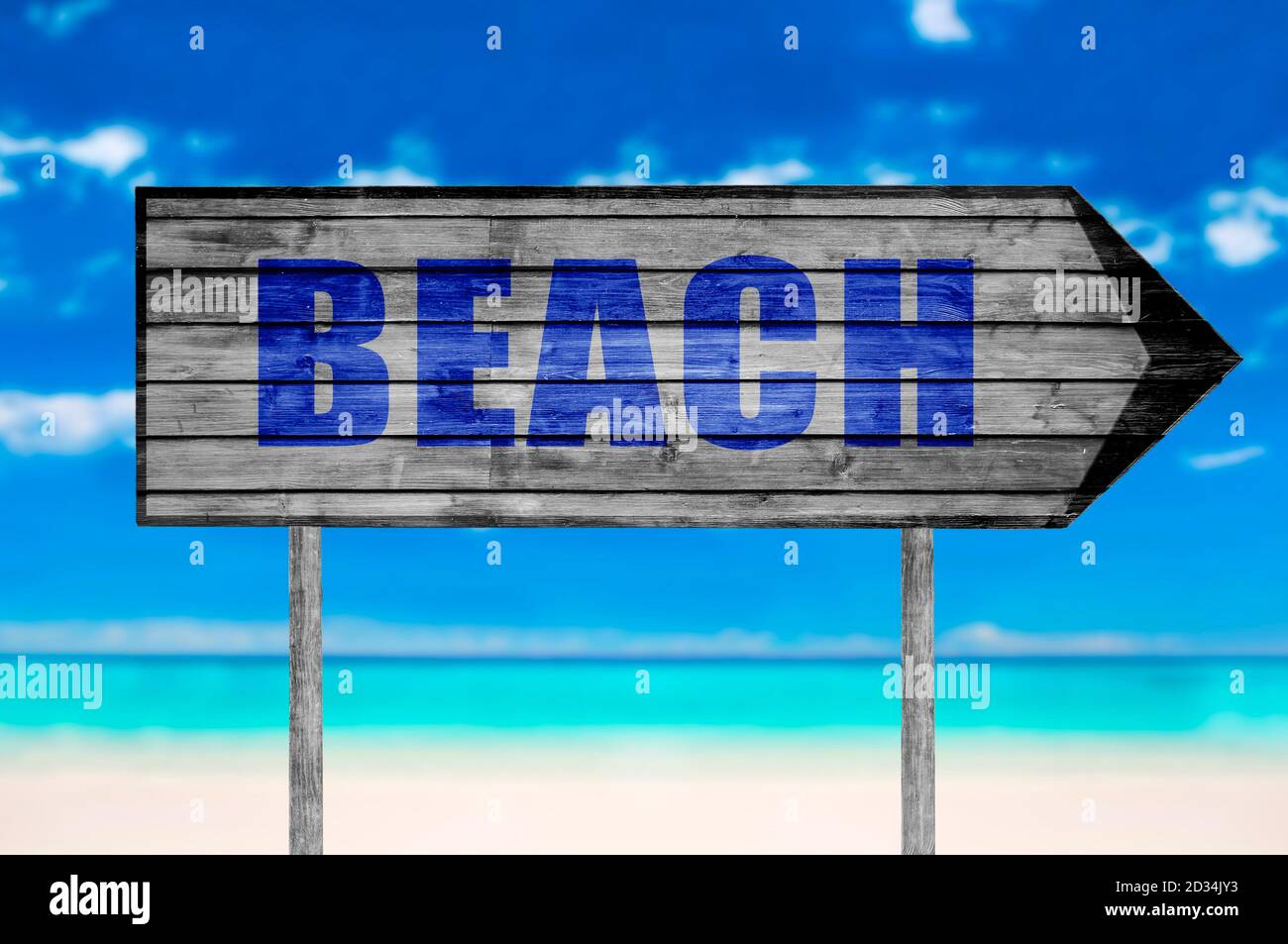 Beach wooden sign with a beach on background Stock Photo - Alamy