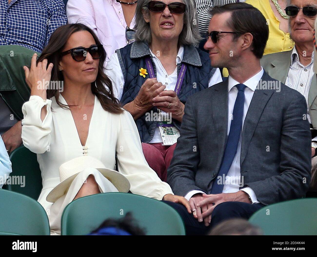 Pippa Middleton and her husband James Matthews hold hands on day eleven of the Wimbledon ...