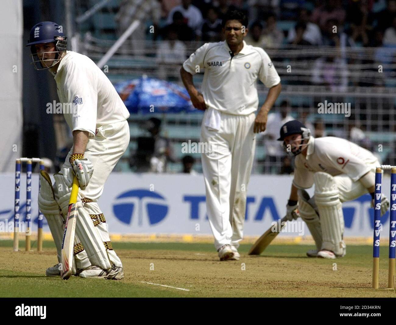 England's Andrew Strauss (L) and Ian Bell make runs as Indian spin ...