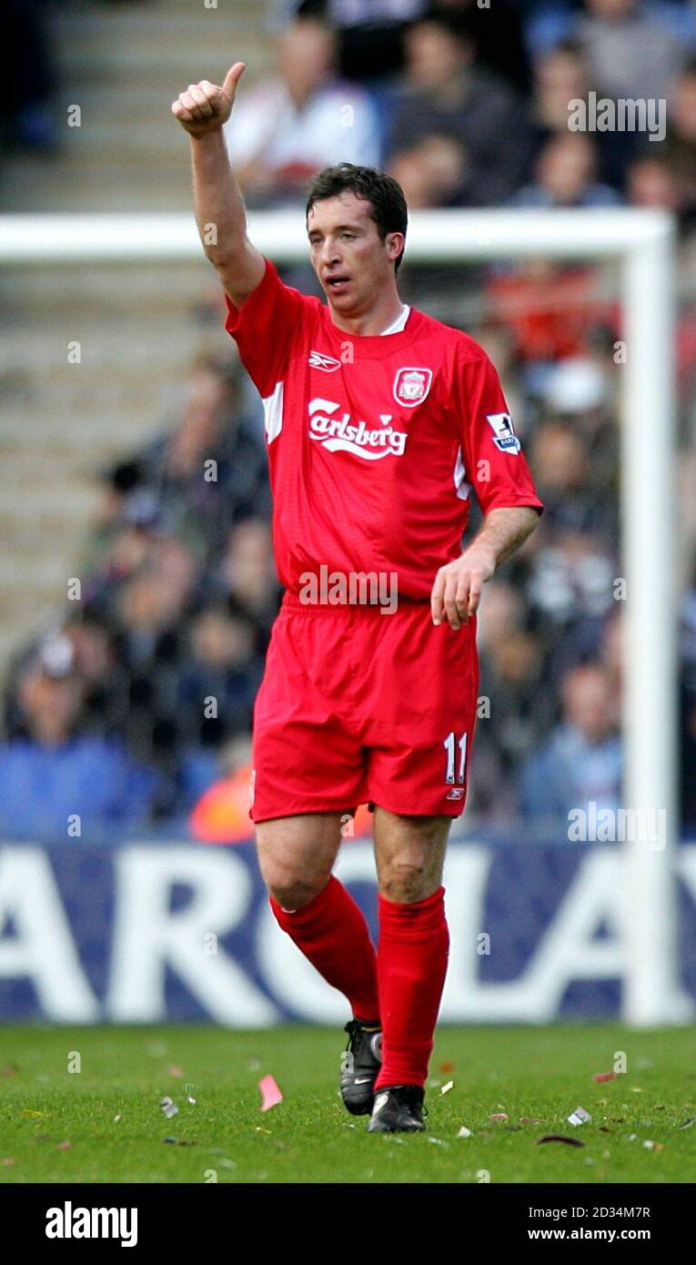 Liverpool's Robbie Fowler celebrates scoring Stock Photo - Alamy