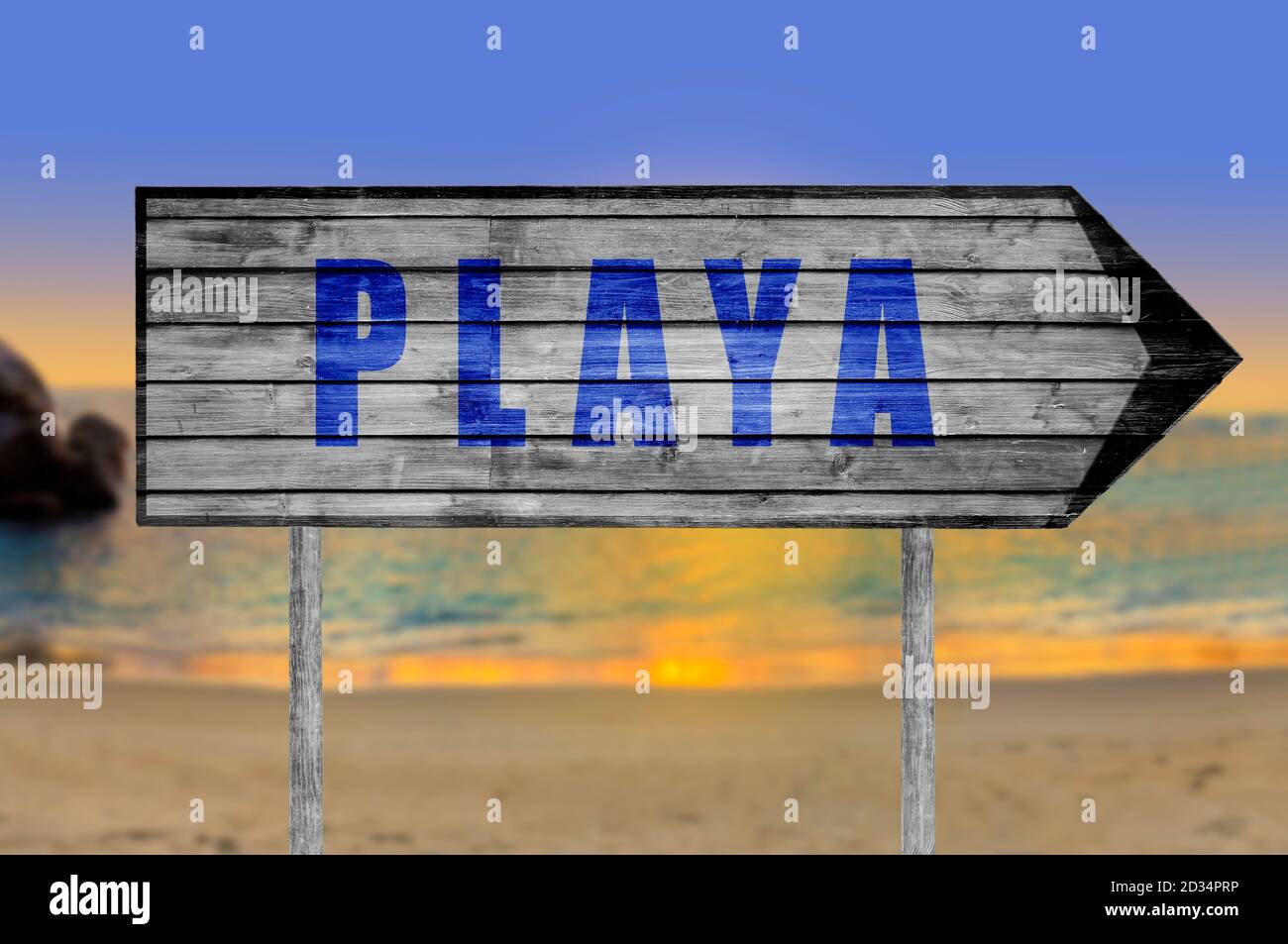 Beach (in Spanish) wooden sign with beach background Stock Photo - Alamy