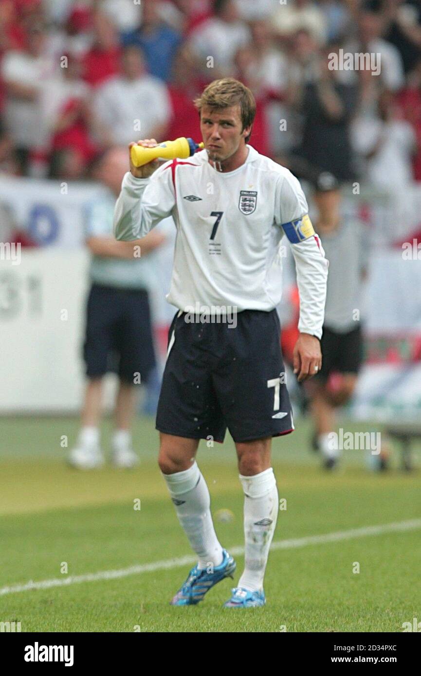 England's David Beckham takes on water in the hot weather Stock Photo ...