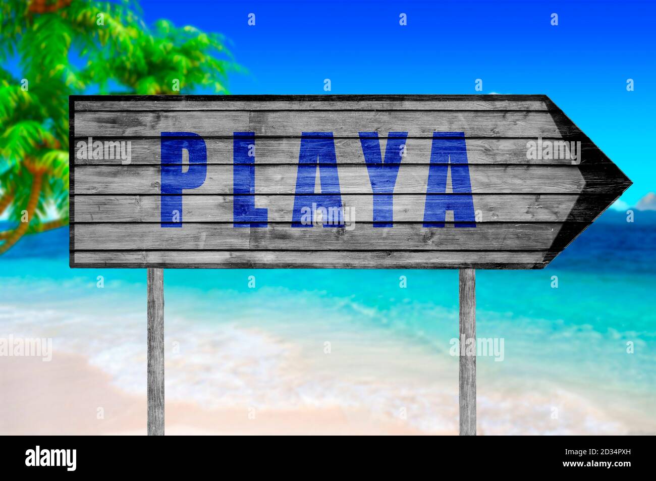 Beach (in Spanish) wooden sign with beach background Stock Photo - Alamy