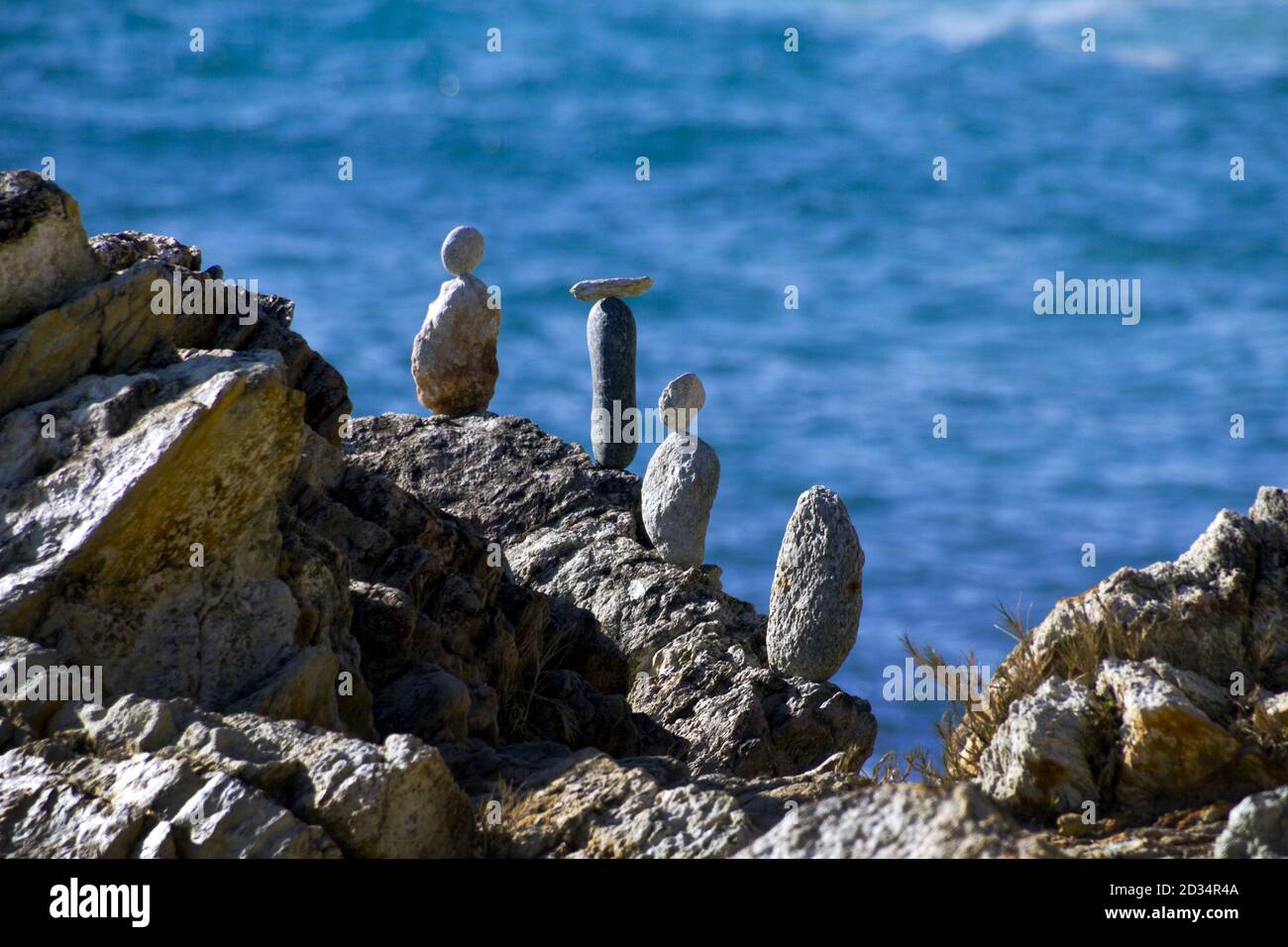Closeup shot of balanced rocks on a cliff by the sea Stock Photo - Alamy