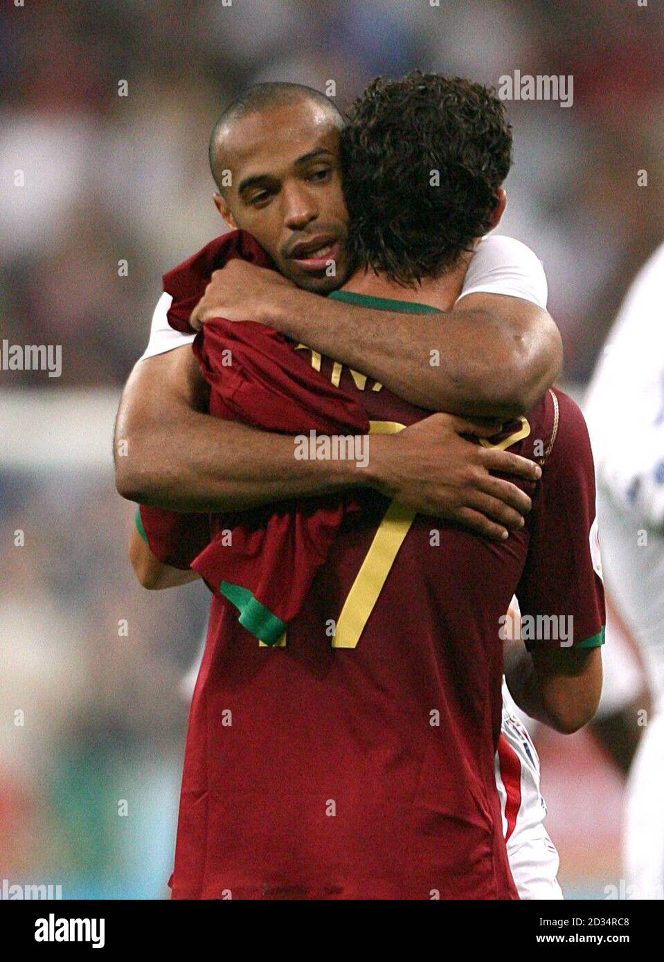 (L-R) France's Thierry Henry hugs Portugal's Cristiano Ronaldo after ...