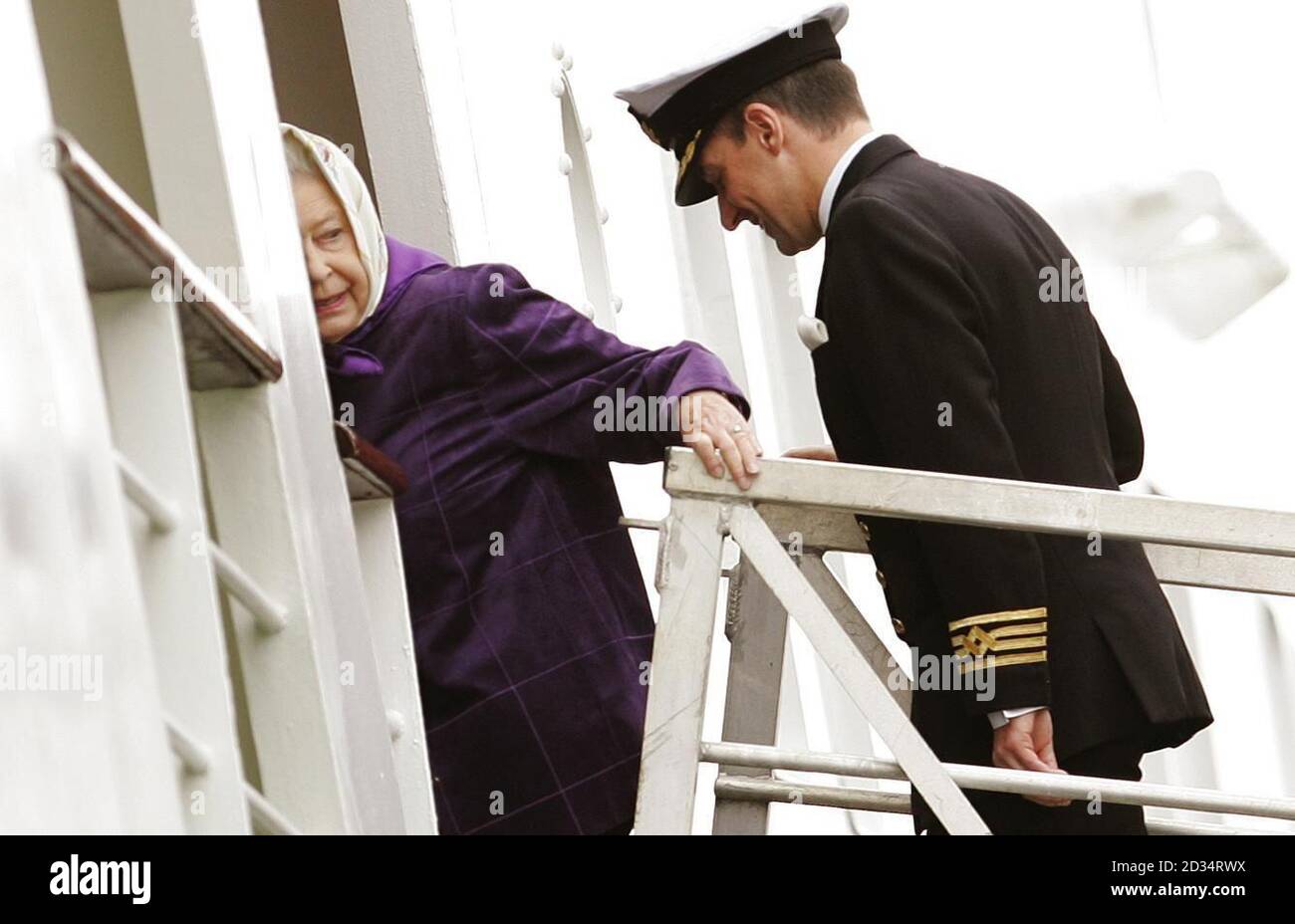 Queen Elizabeth II and captain Michael Hepburn arrive to embark on the ...