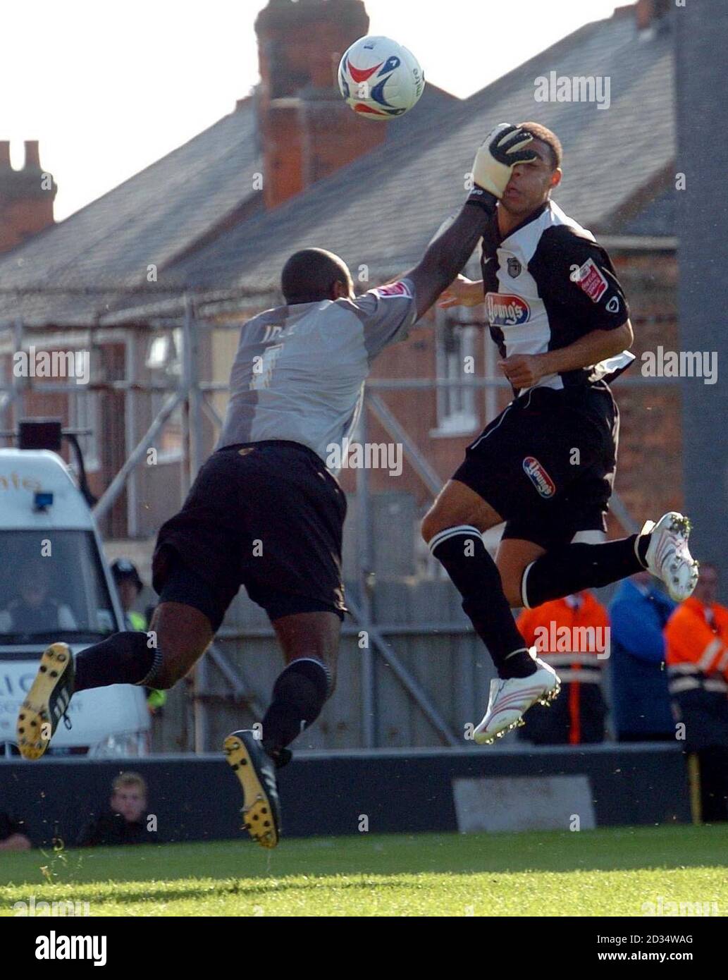 Grimsby's Peter Rore (right) heads past Walsall's goalkeeper Clayton ...