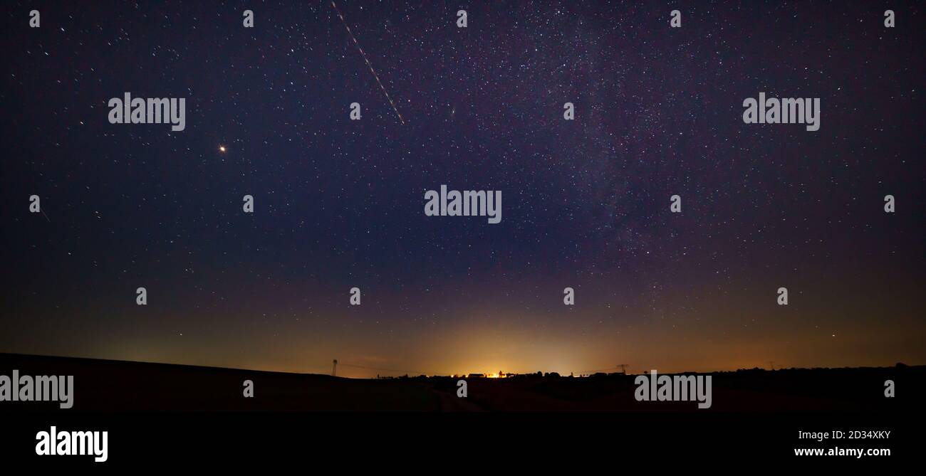 Night landscape with light from the city on the horizon Stock Photo - Alamy