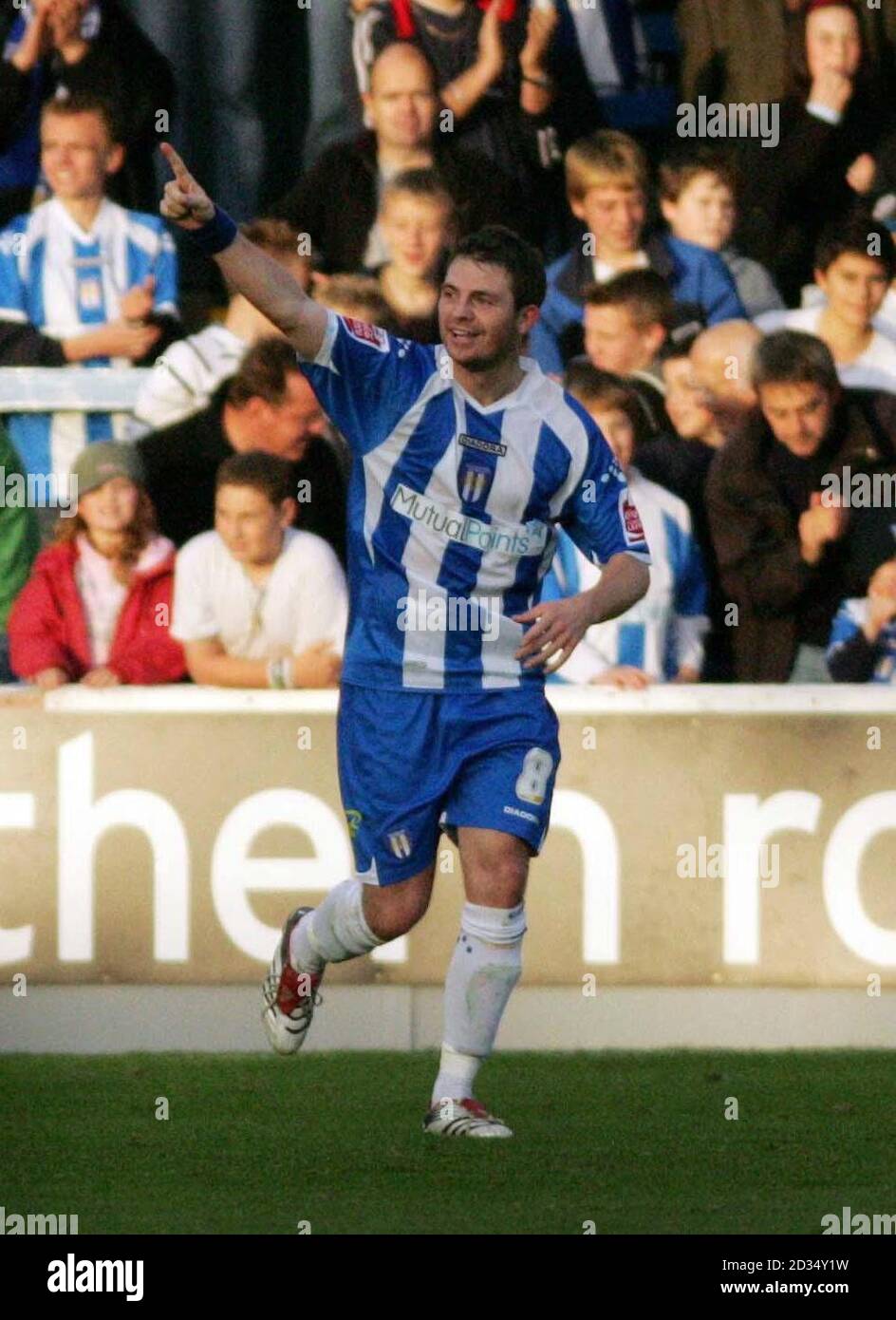 Colchester's Jamie Cureton celebrates scoring during the Coca-Cola ...