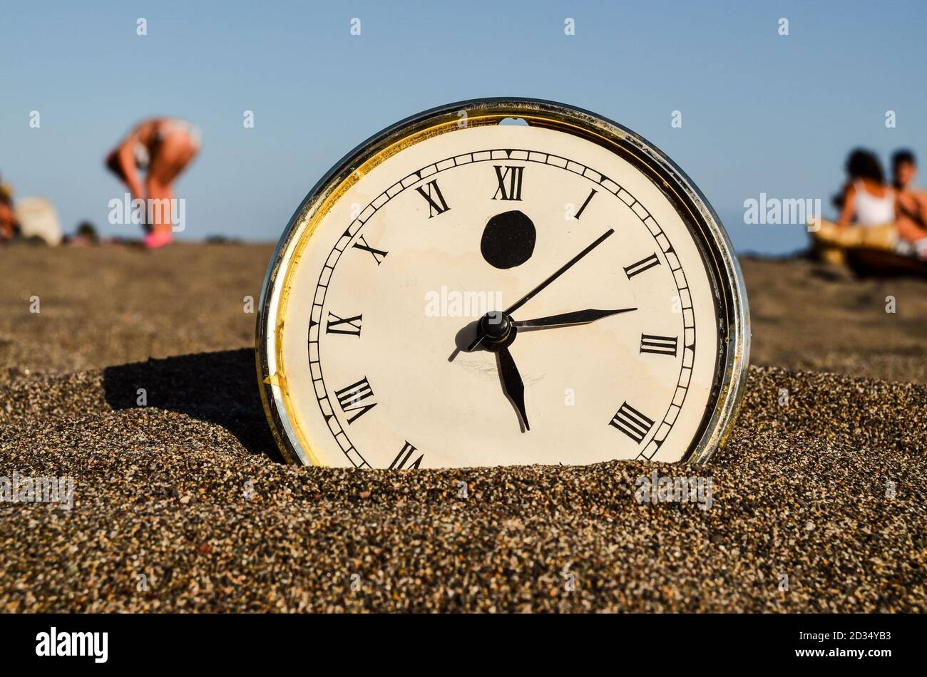 Clock on the Sand Beach Stock Photo - Alamy