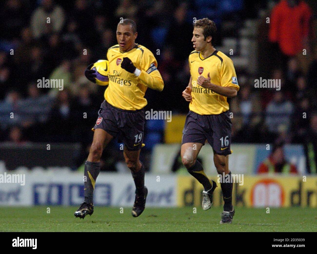 Arsenal's Gilberto Silva (l) celebrates scoring by running to place the ...