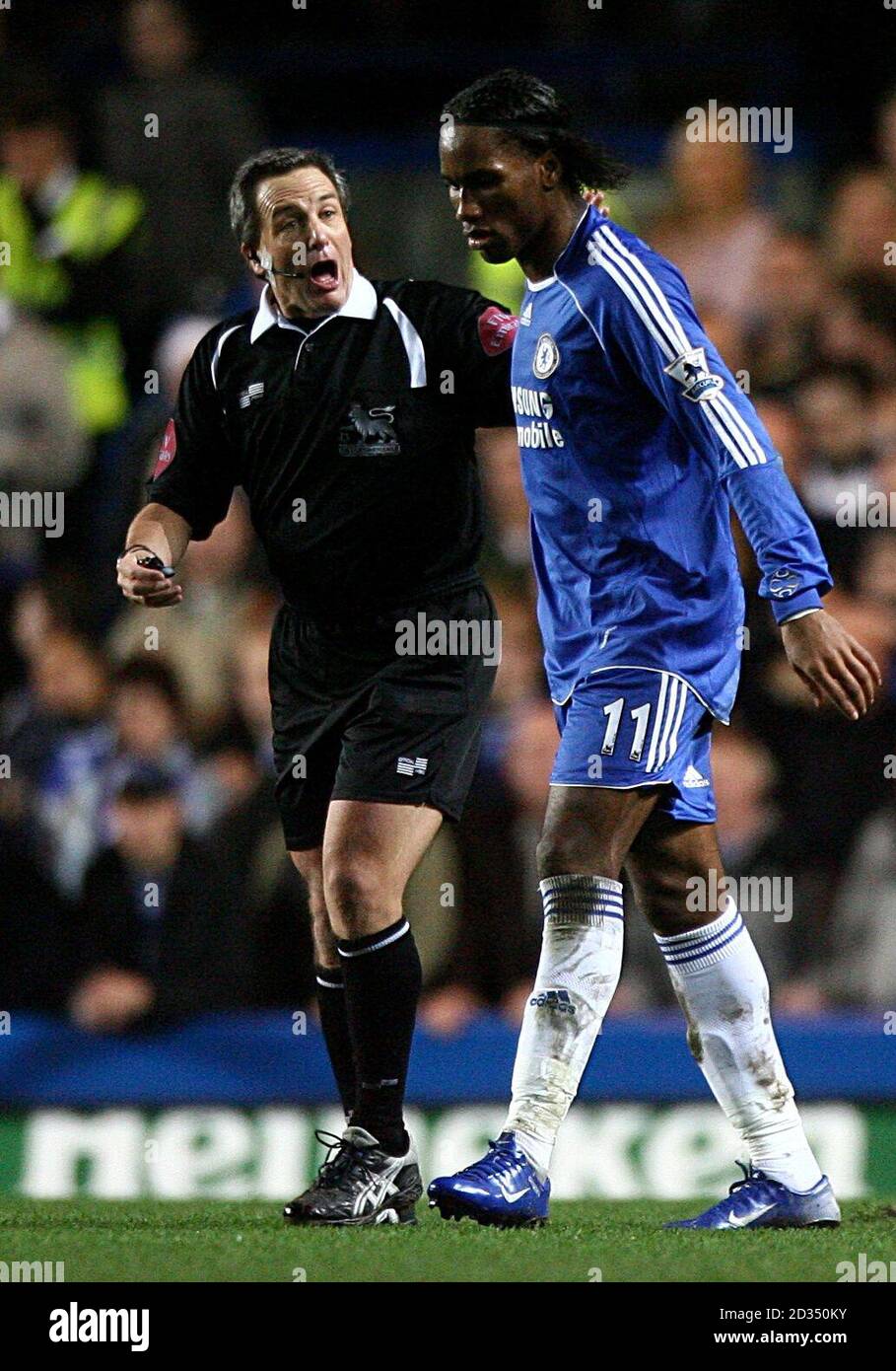 Referee Alan Wiley has words with Chelsea's Didier Drogba Stock Photo ...