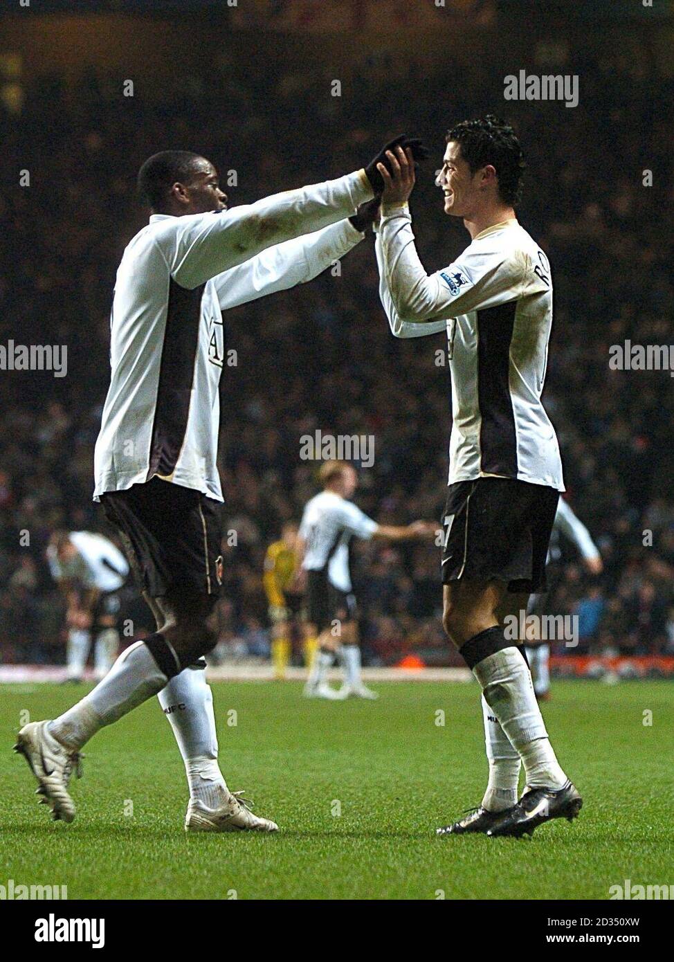 Manchester United's Louis Saha (l) congratulates Cristiano Ronaldo on ...