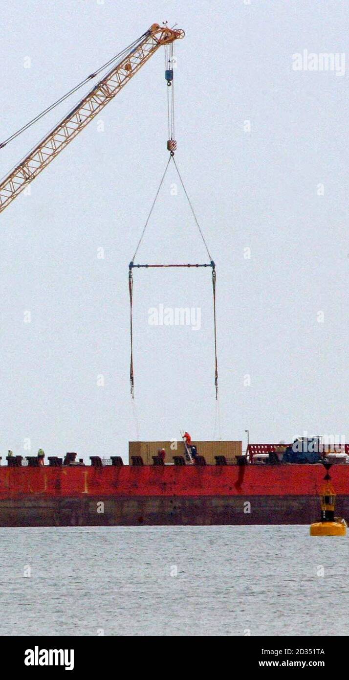 The first container is lifted from the grounded cargo ship MSC Napoli ...